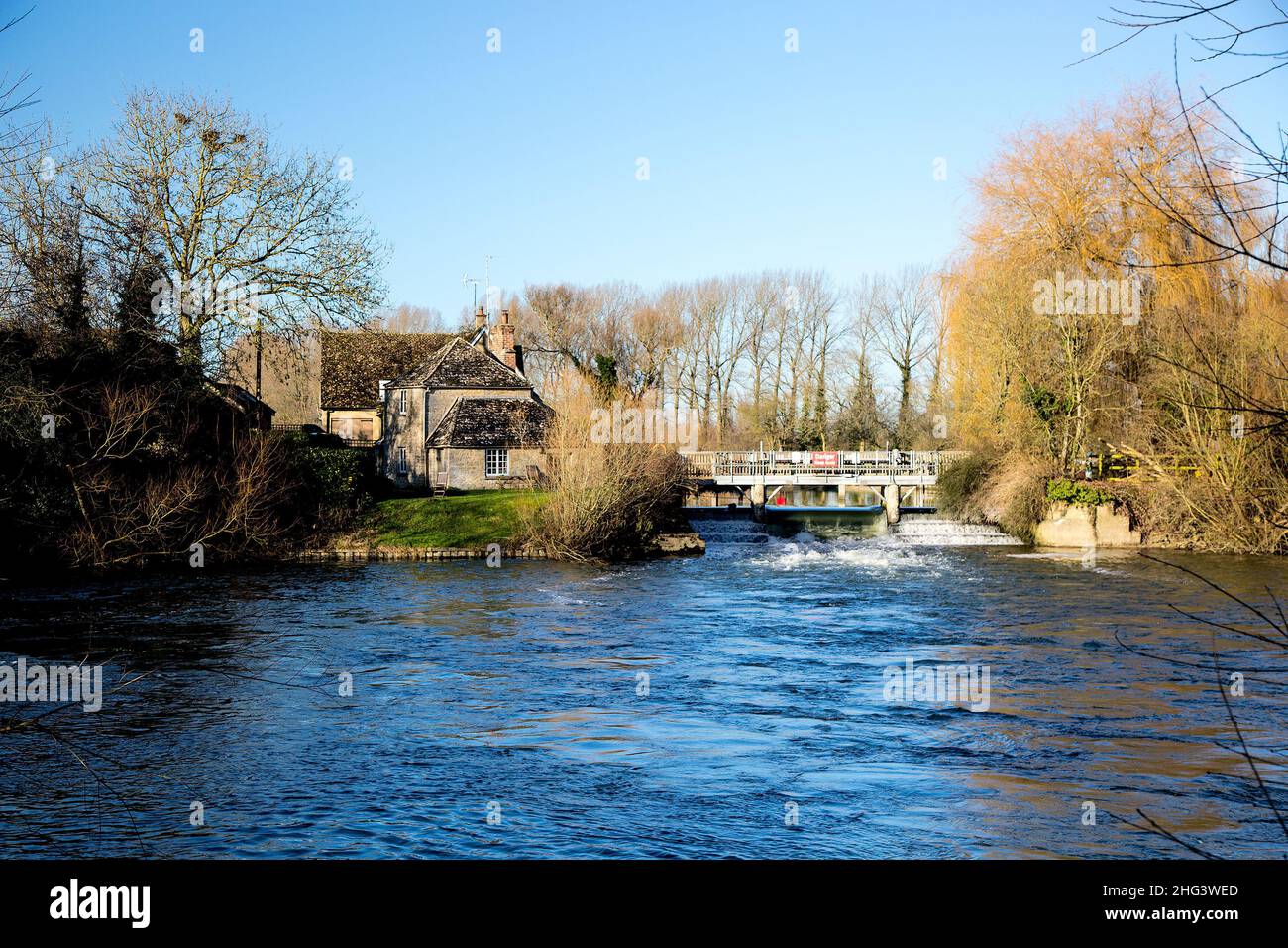 A beautiful, sunny, winter's day with cloudless blue sky at Buscot Lock ...