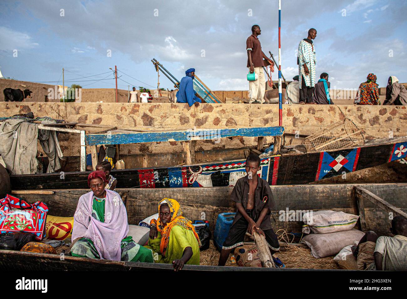 Passengers sitting in pirogue at Port of Gao by the River Niger. Gao ...