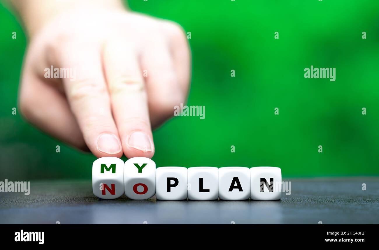 Hand turns dice and changes the expression "no plan" to "my plan Stock ...