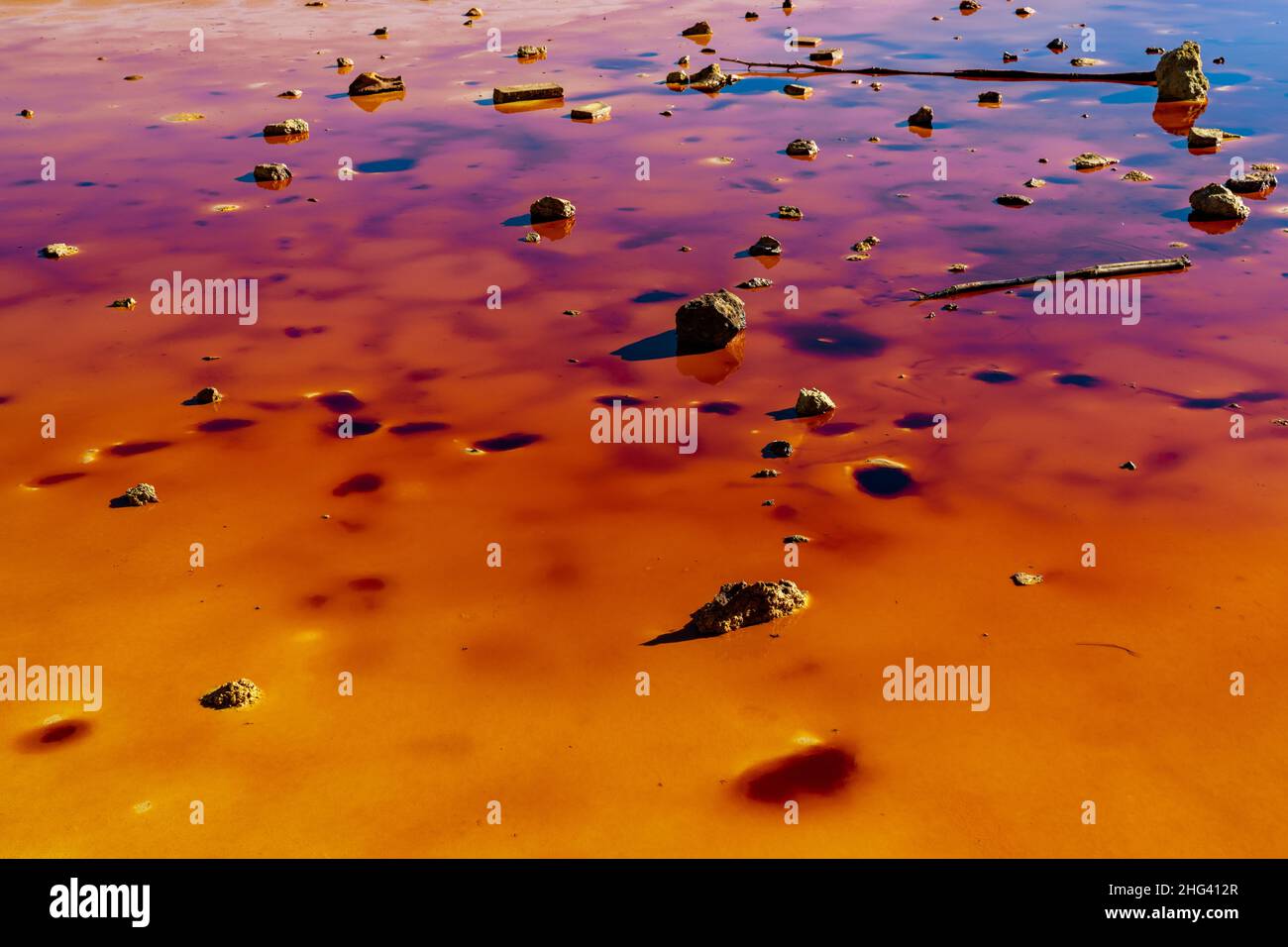 A colorful small pond with toxic and poisonous water in an old ...