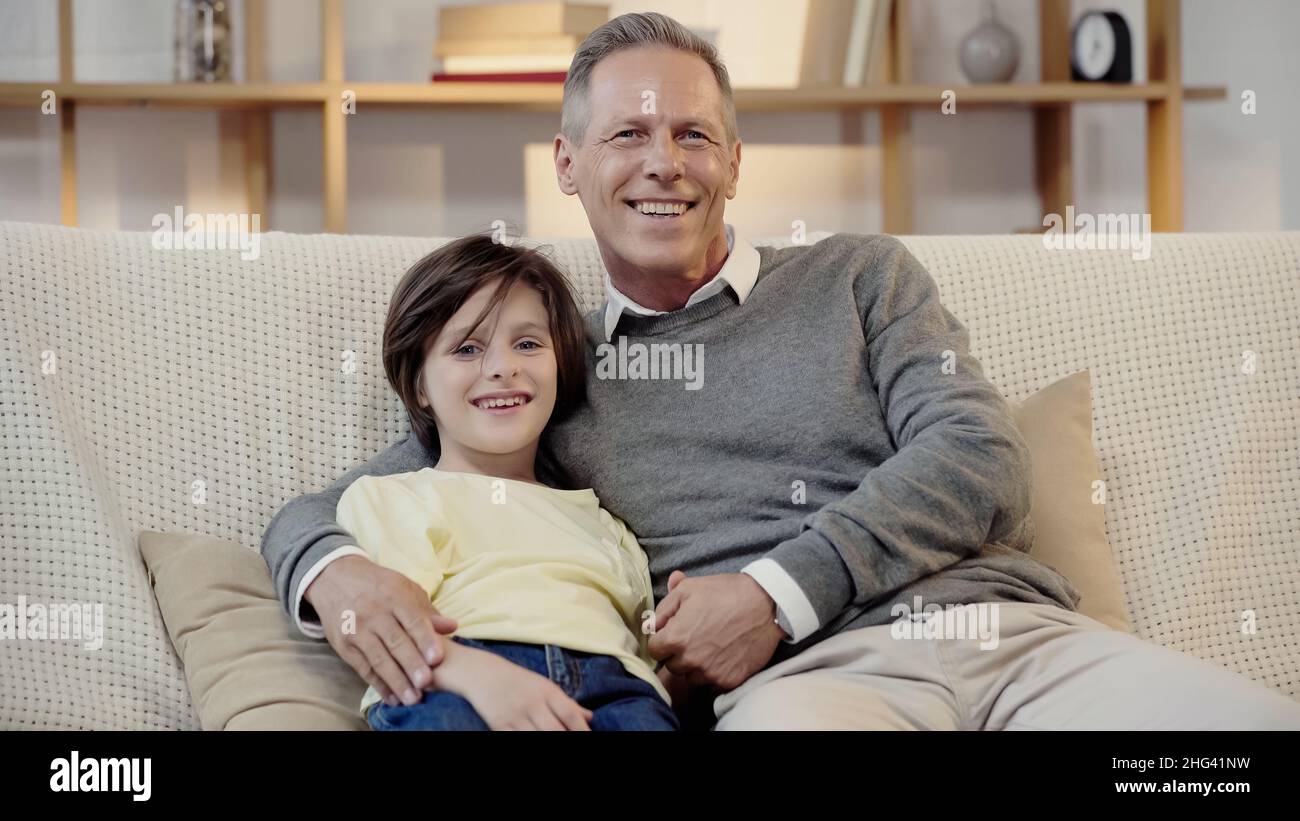 joyful middle aged grandfather smiling with happy grandson Stock Photo ... joyful middle aged grandfather smiling with happy grandson Stock Photo ...