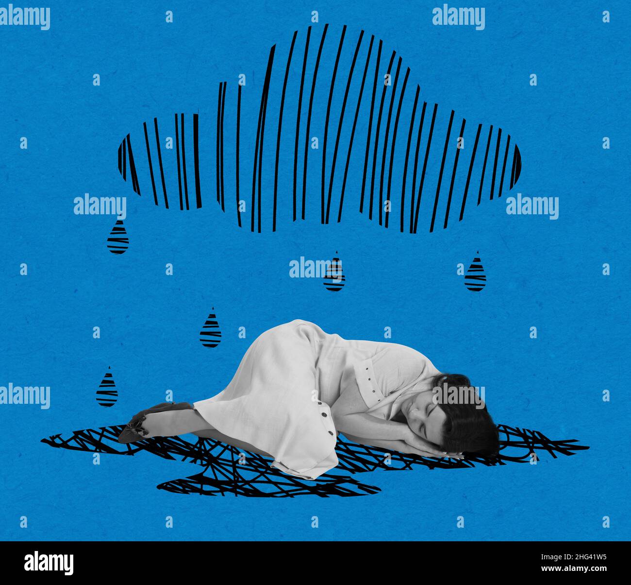 Sad young girl lying on floor under cloud of depression, problems ...