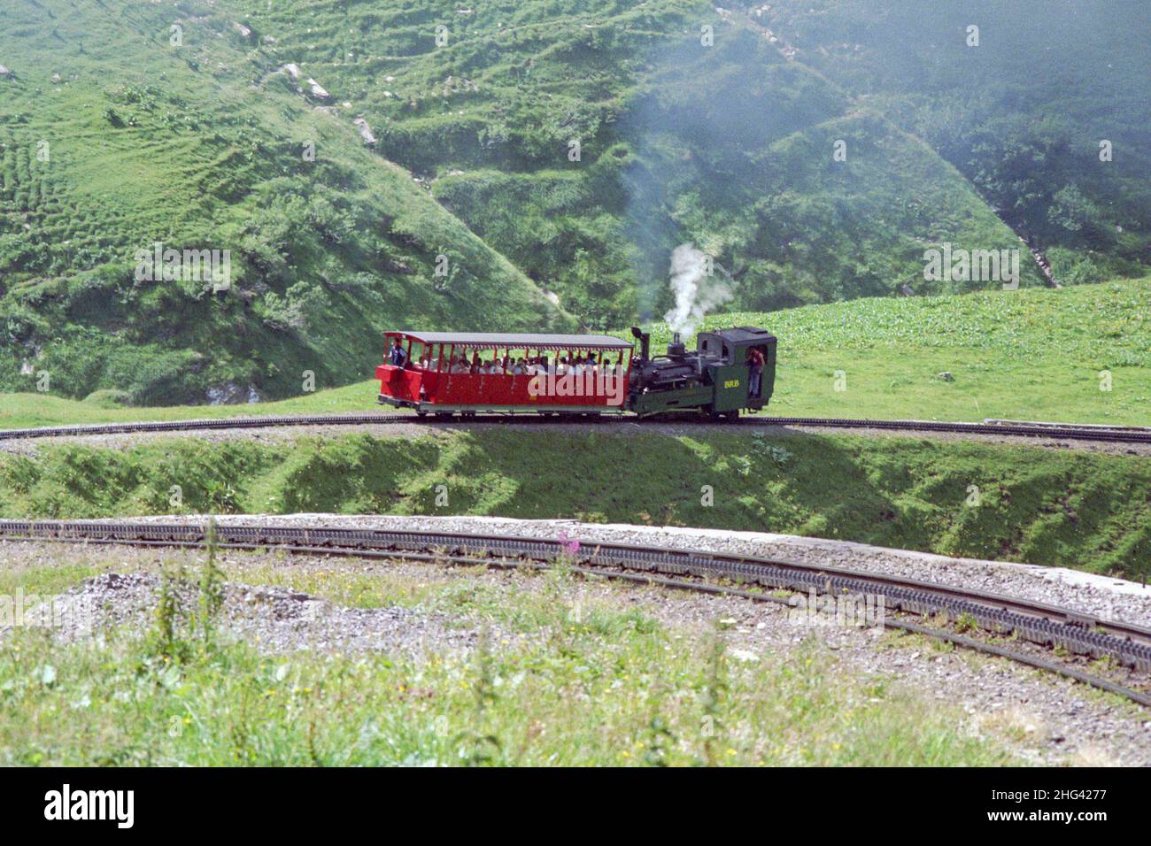A steam railway passenger train on the Brienz Rothorn railway in 2002 ...