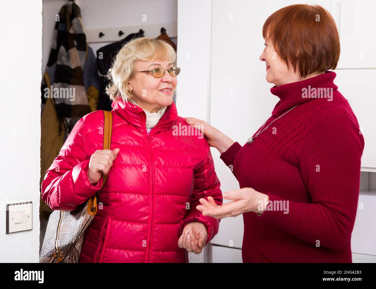 Mature lady visiting her neighbor Stock Photo - Alamy