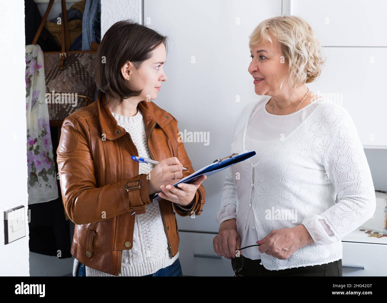 Social survey with mature woman Stock Photo - Alamy