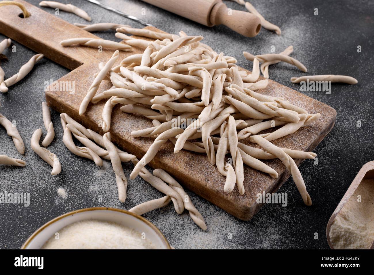 Whole grain wheat apulian pasta called Pizzarieddi or maccaruni on a ...