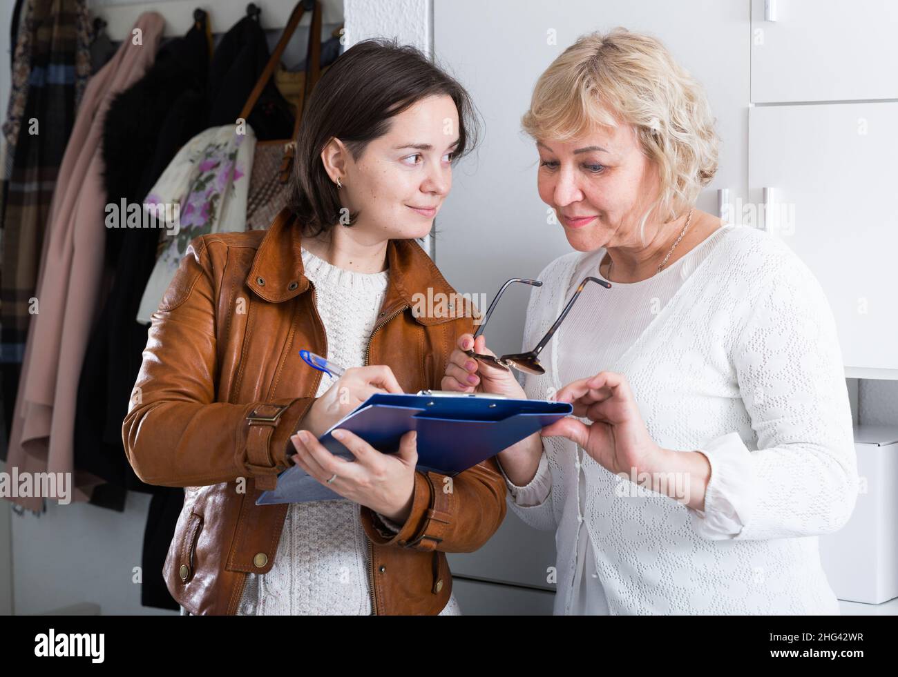 Social survey with mature woman Stock Photo - Alamy