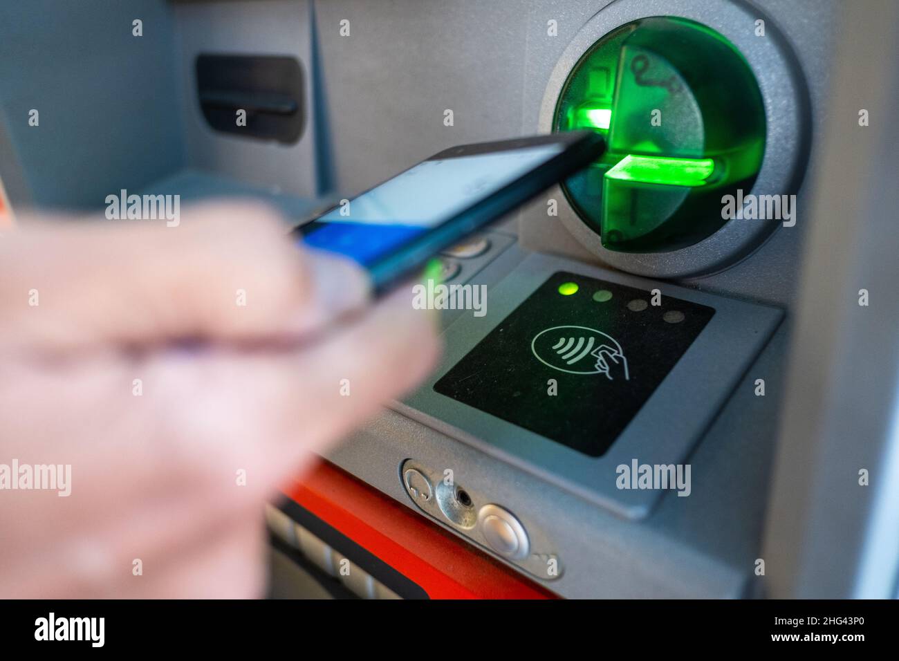 Person using a atm hi-res stock photography and images - Alamy