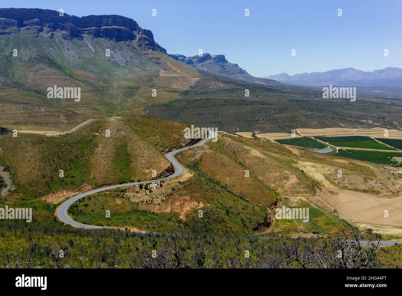 Twisted road going through the mountains Stock Photo - Alamy