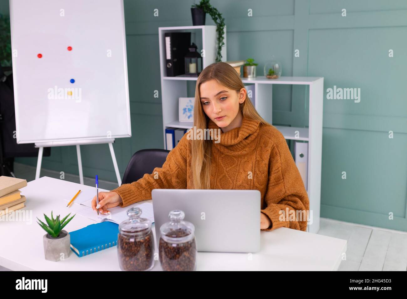 Happy smiling teenage girl student watching learning online video zoom ...
