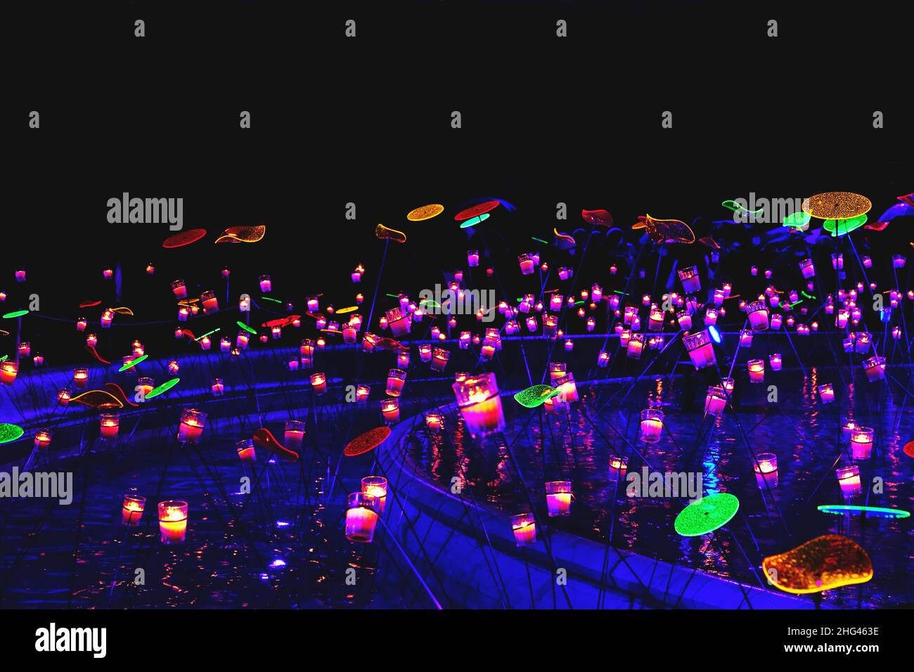 Lights festival display and candles inside the fountain of Place des ...