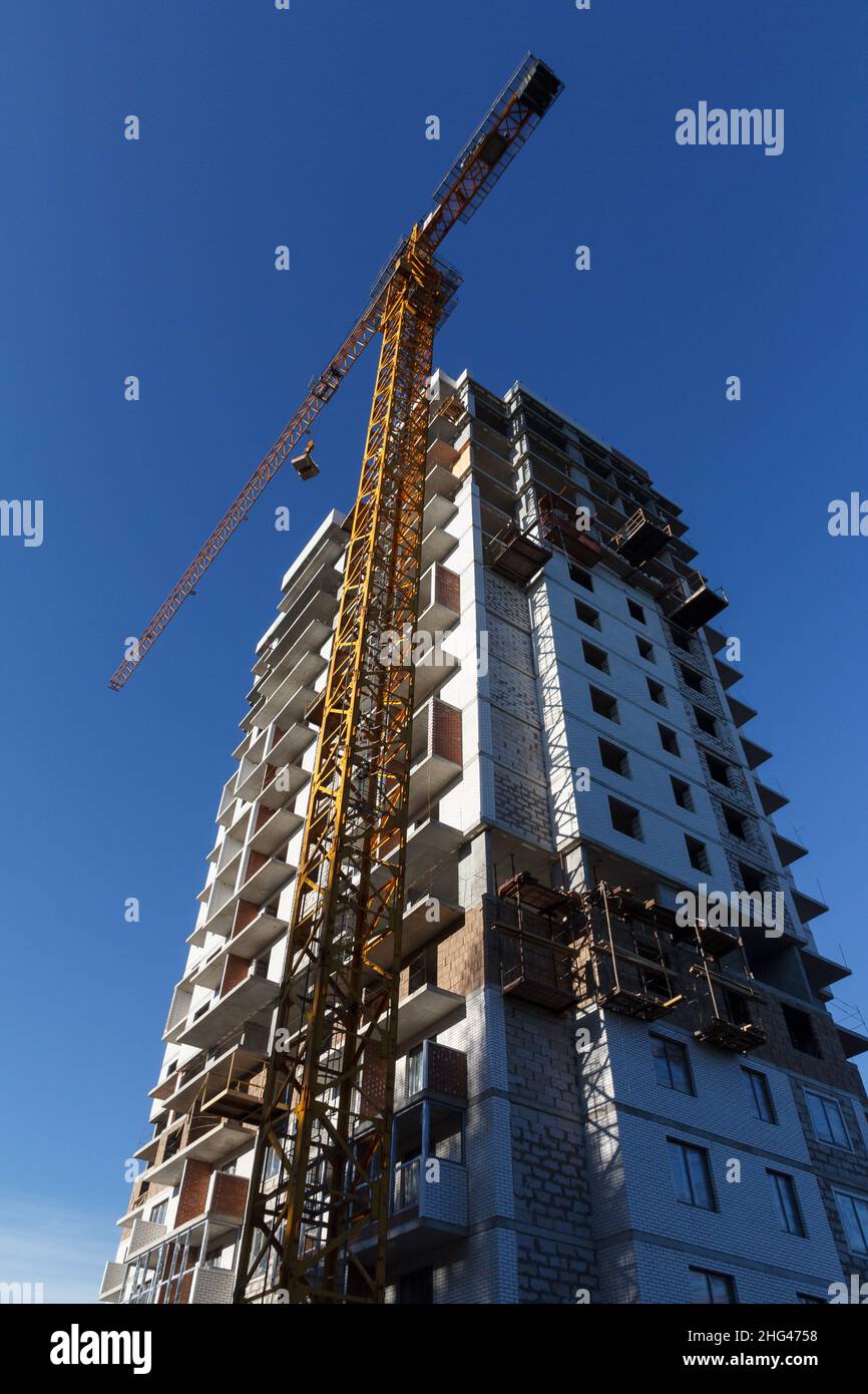 Residential building construction process. Facade of a modern apartment ...