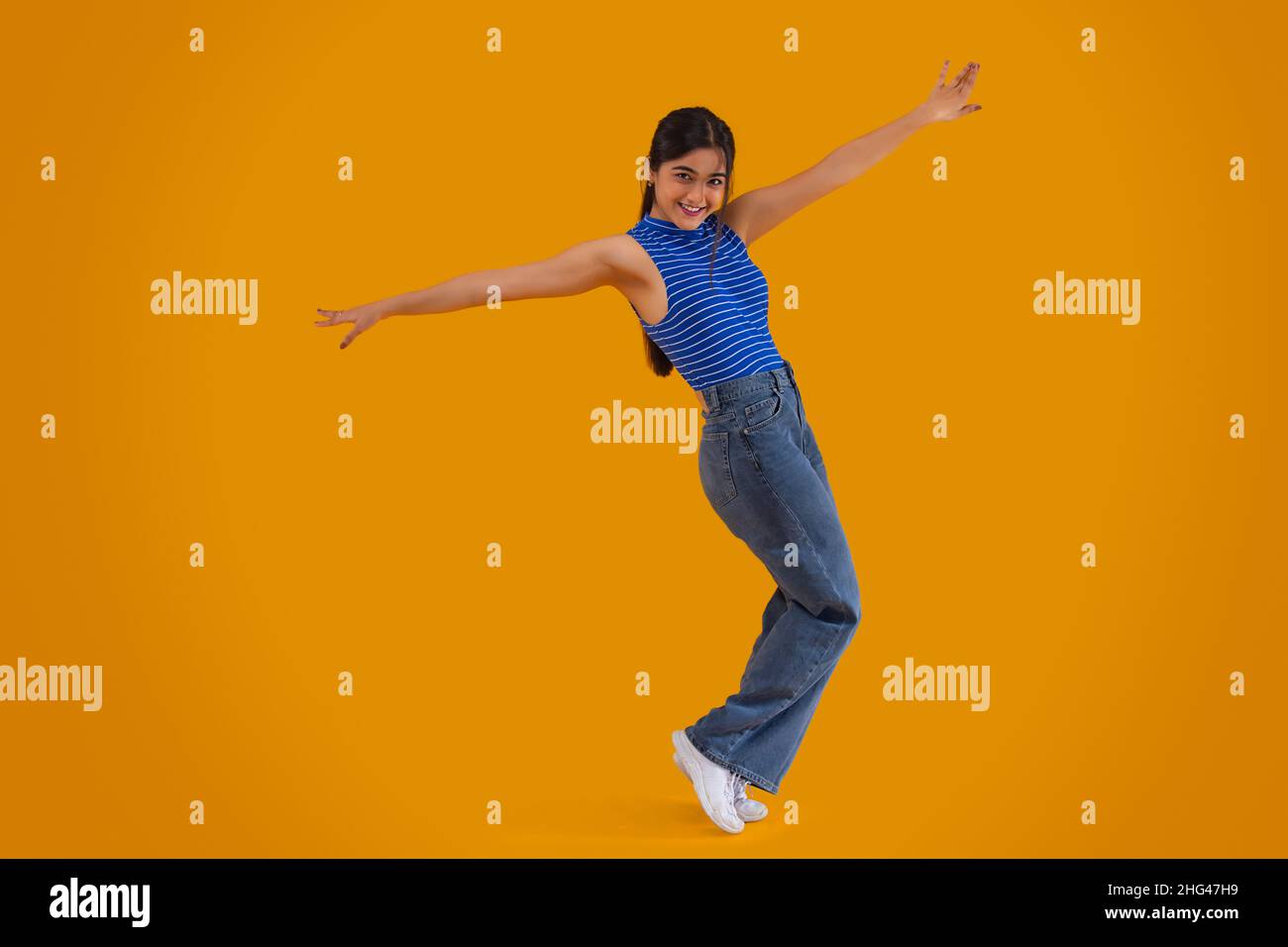 Girl standing on toes hi-res stock photography and images - Alamy