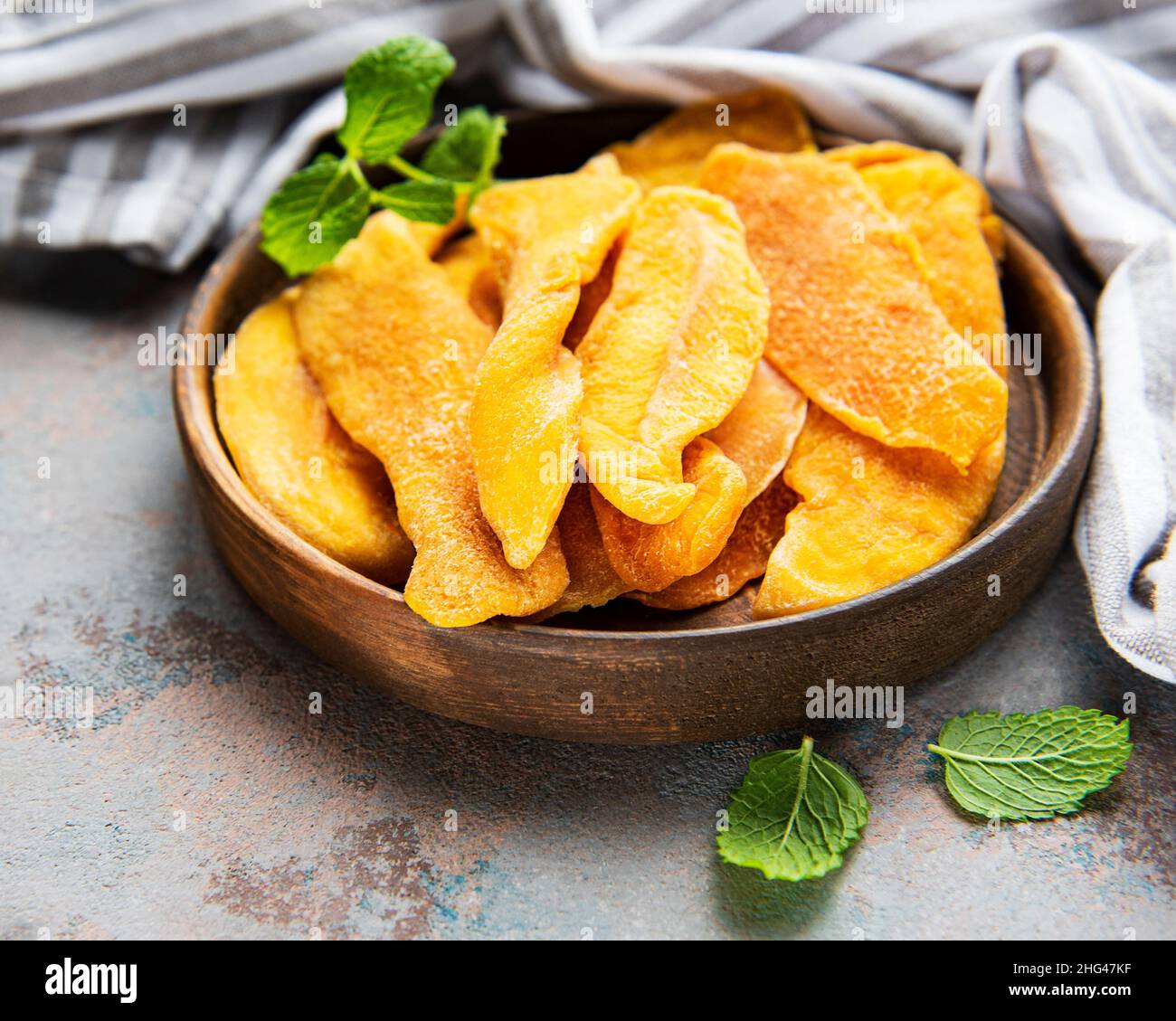 Dried Mango Fruit on grey concrete background Stock Photo - Alamy