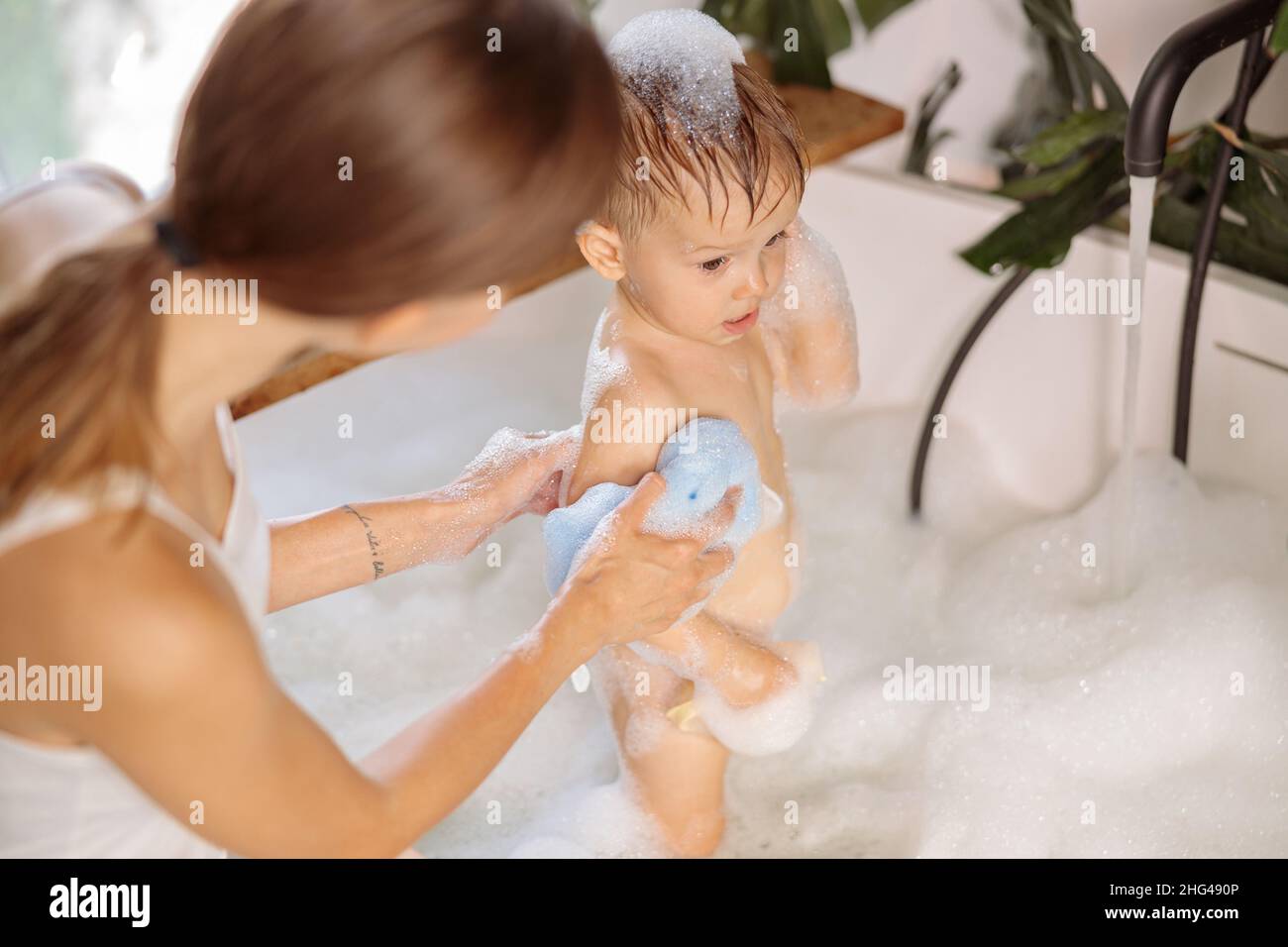 Mother washing adult son hi-res stock photography and images - Alamy