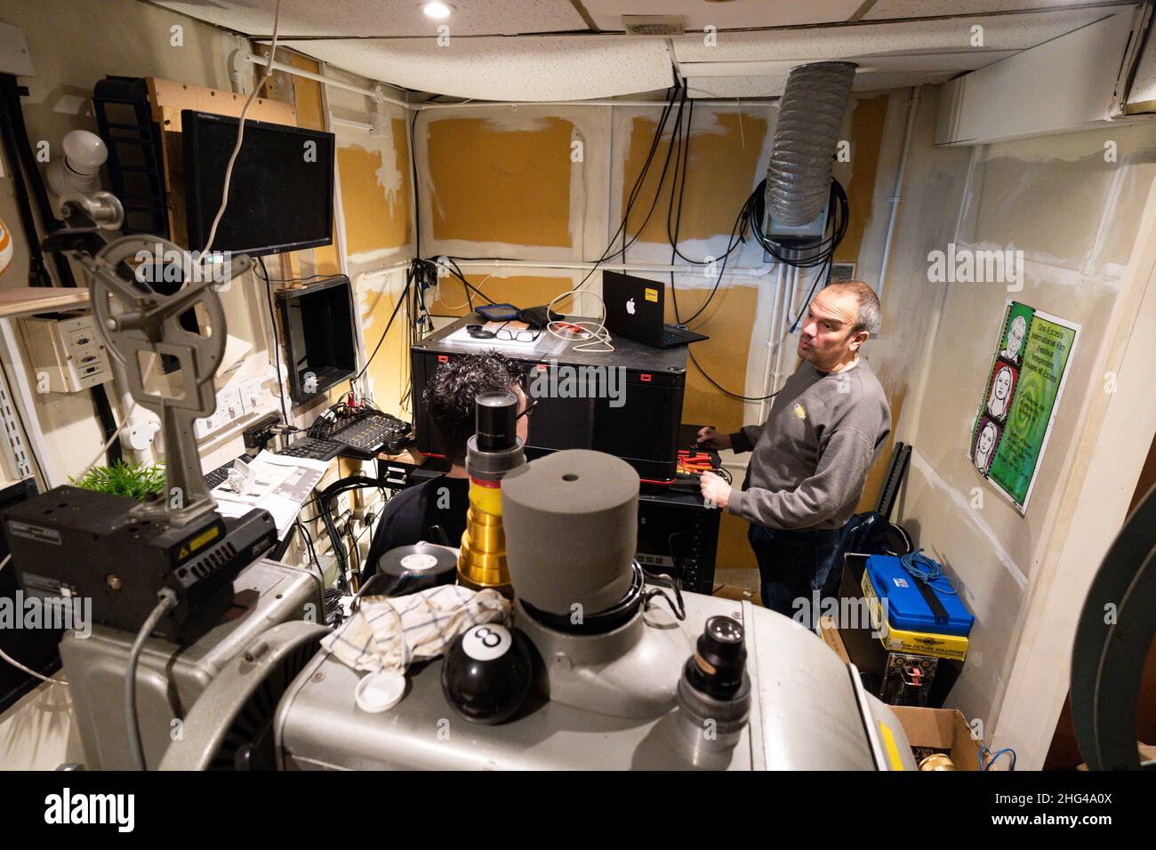 Owner Kevin Markwick and an engineer working in the projection booth ...