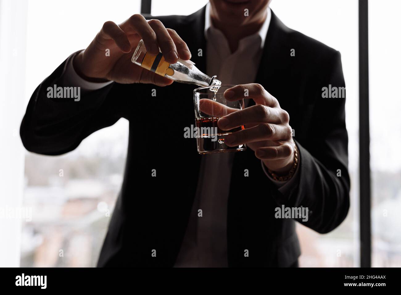 Man pours alcohol in small hi-res stock photography and images - Alamy