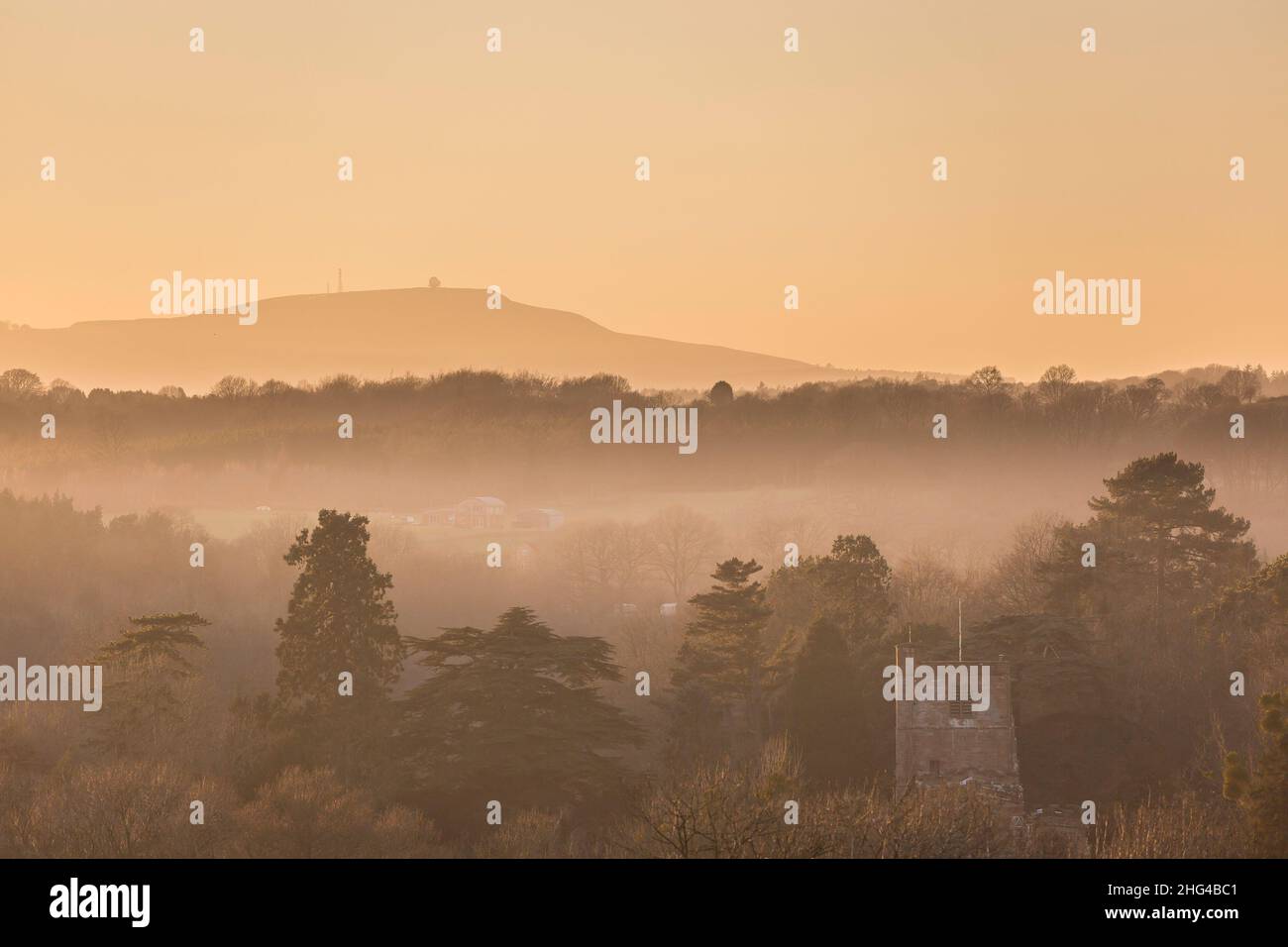 Misty Worcestershire sunset with Clee Hill radar tower in background ...