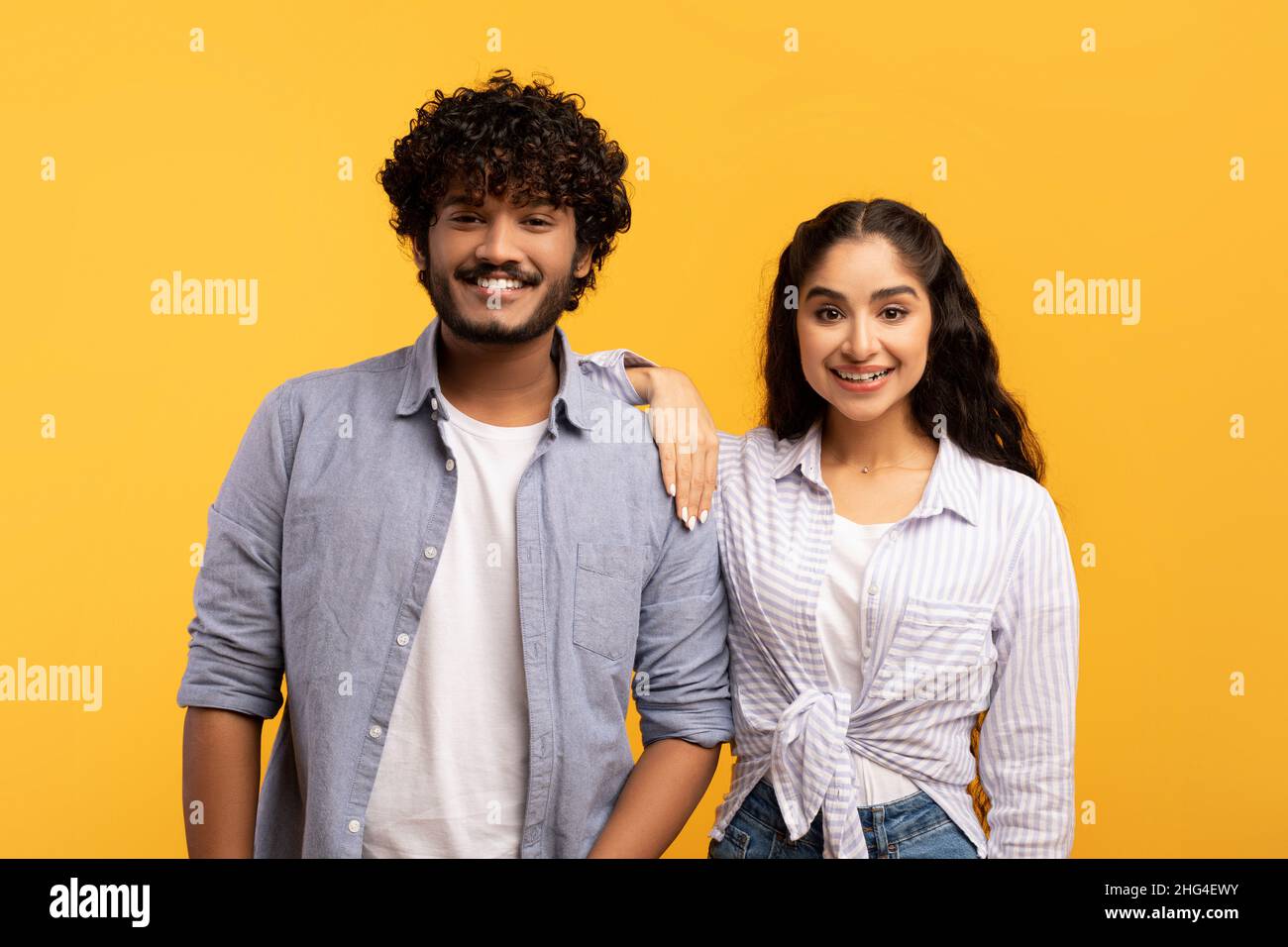 Happy millennials. Portrait of romantic indian spouses posing over ...