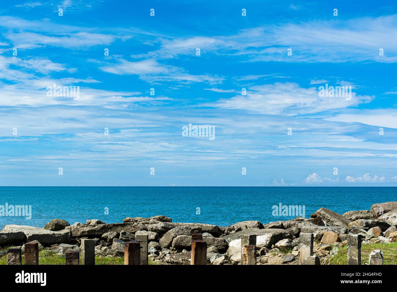 Blue sea under blue skies with white clouds at Tanjung Aru Beach, Kota ...