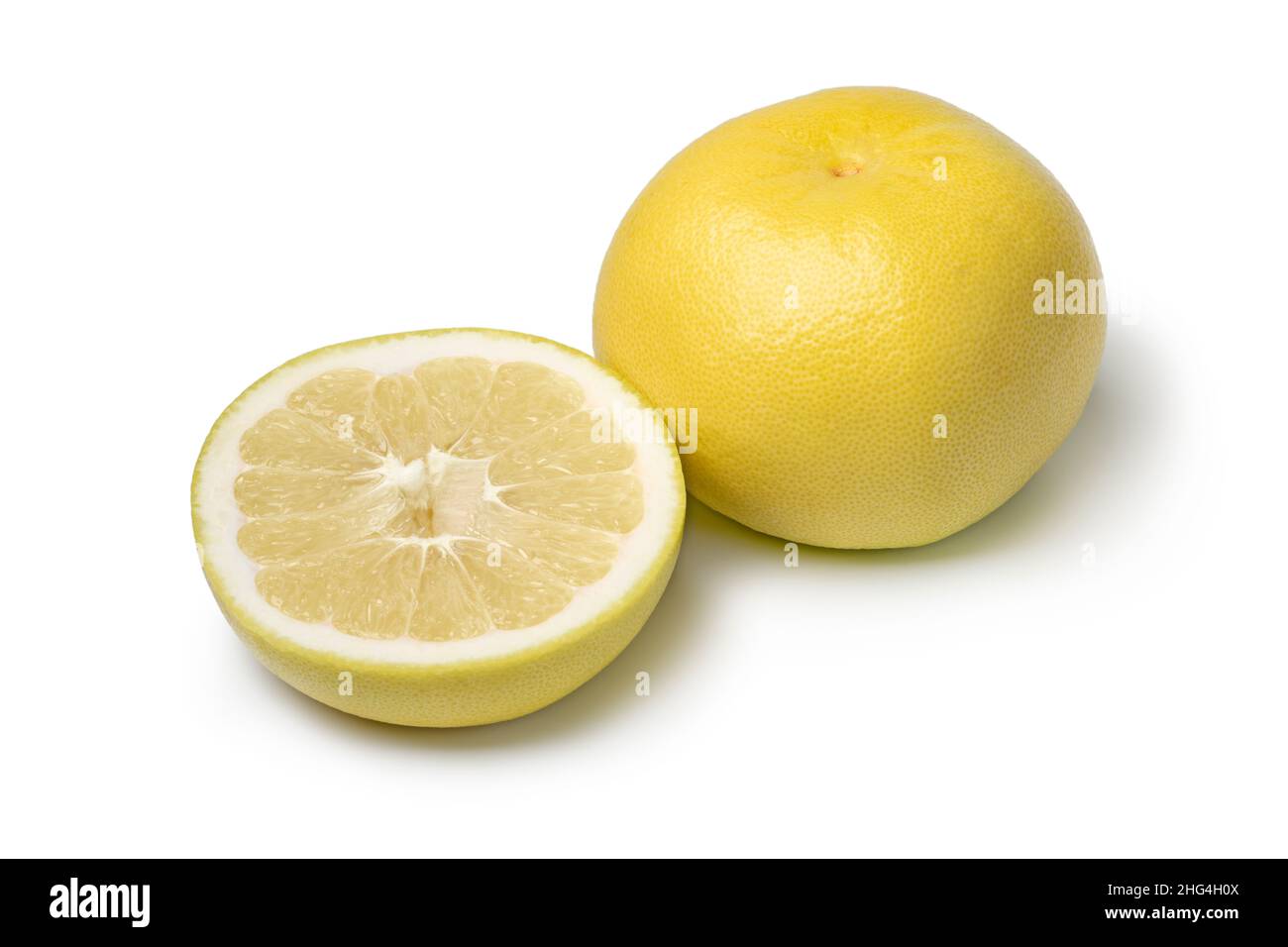 Whole and halved Sweetie citrus fruit close up isolated on white ...