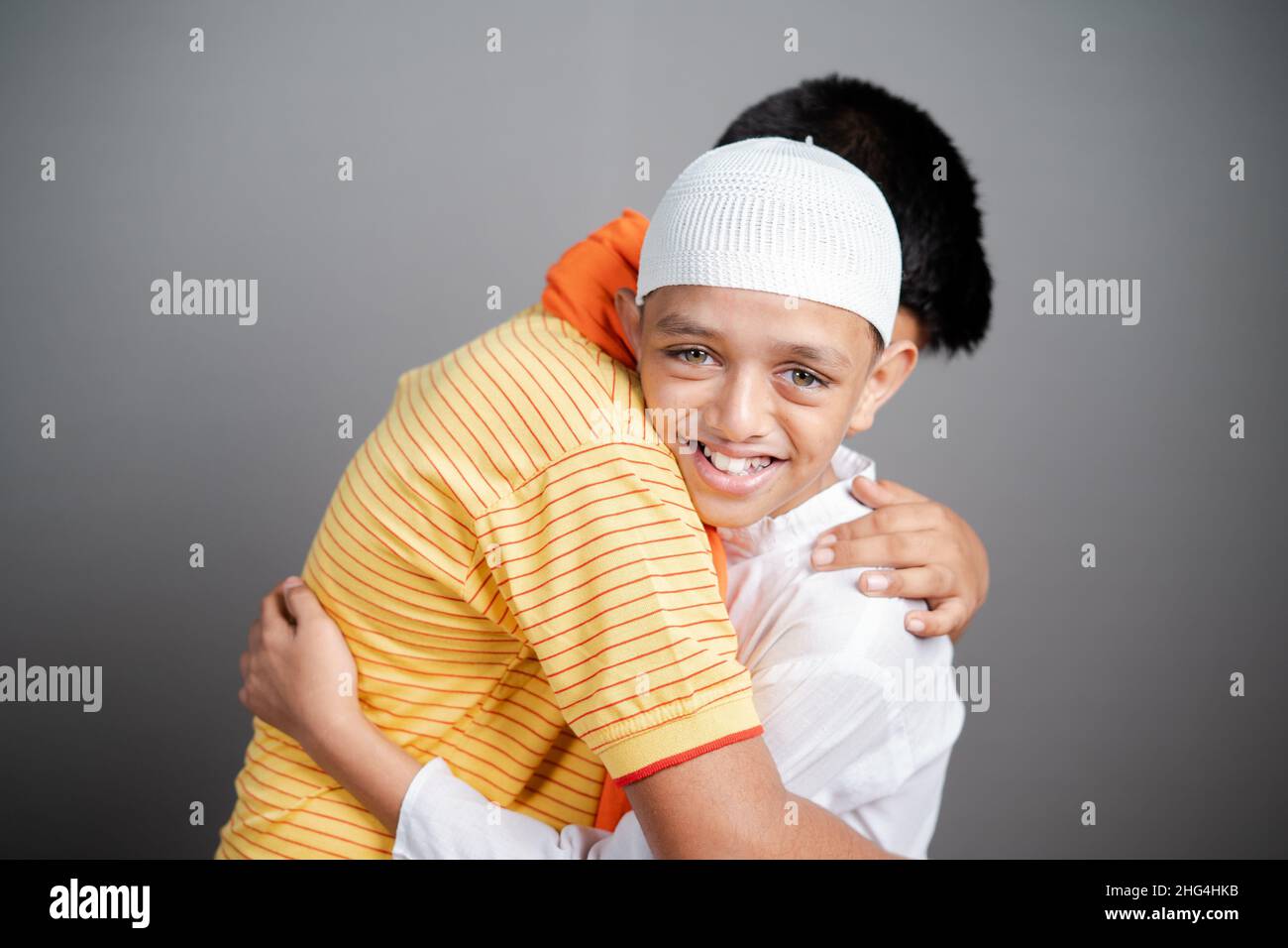 Happy Hindu Muslim Children embracing Each Other and looking camera ...