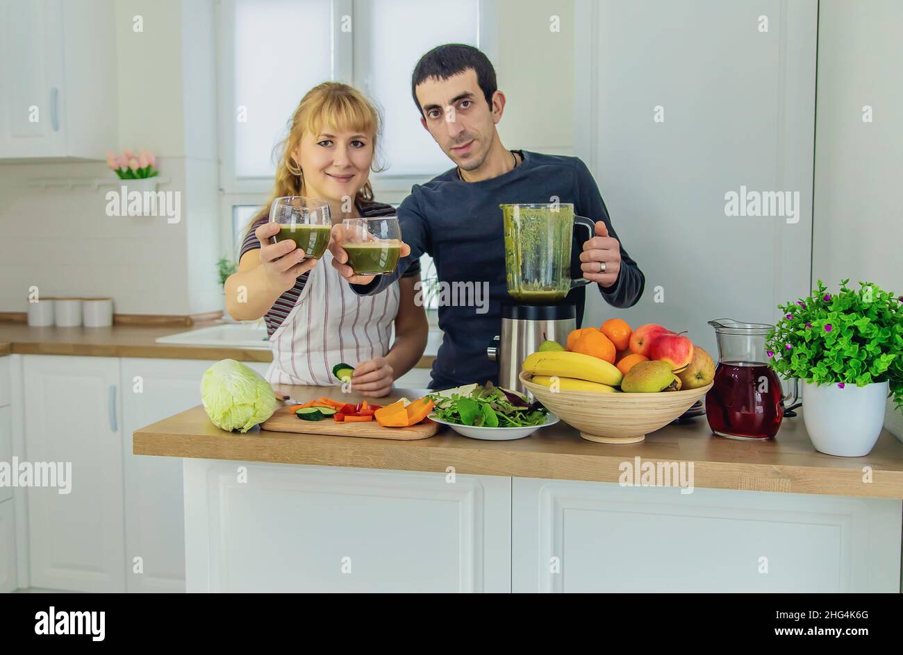 The family is making smoothies in the kitchen. Selective focus Stock ...
