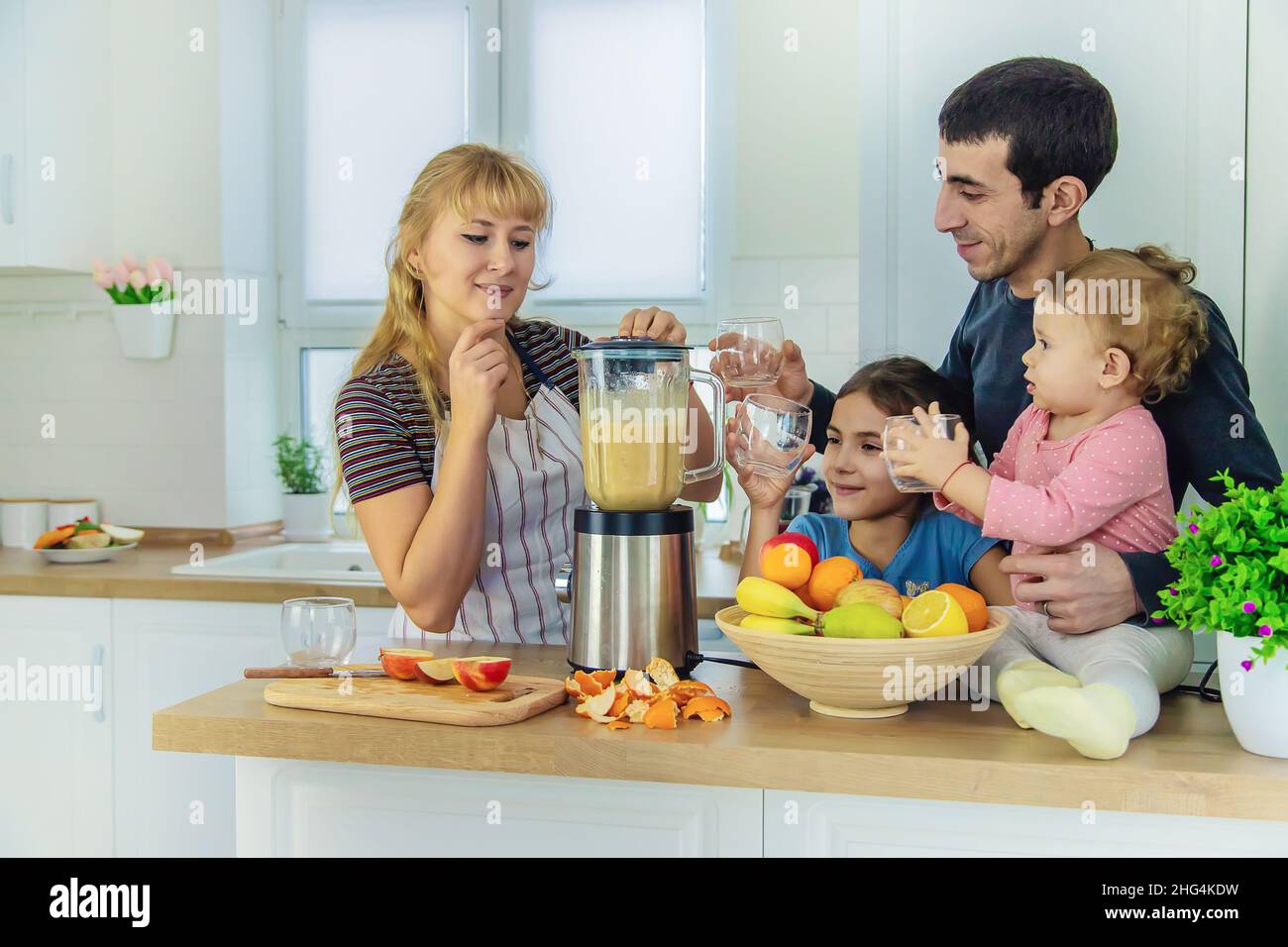 The family is making smoothies in the kitchen. Selective focus Stock ...
