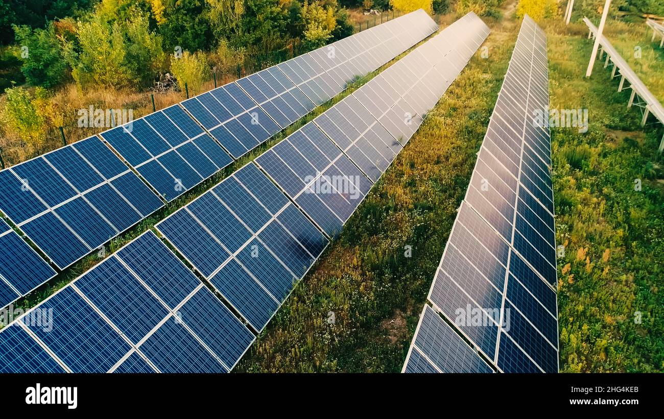 Aerial view of solar panels system on field Stock Photo - Alamy