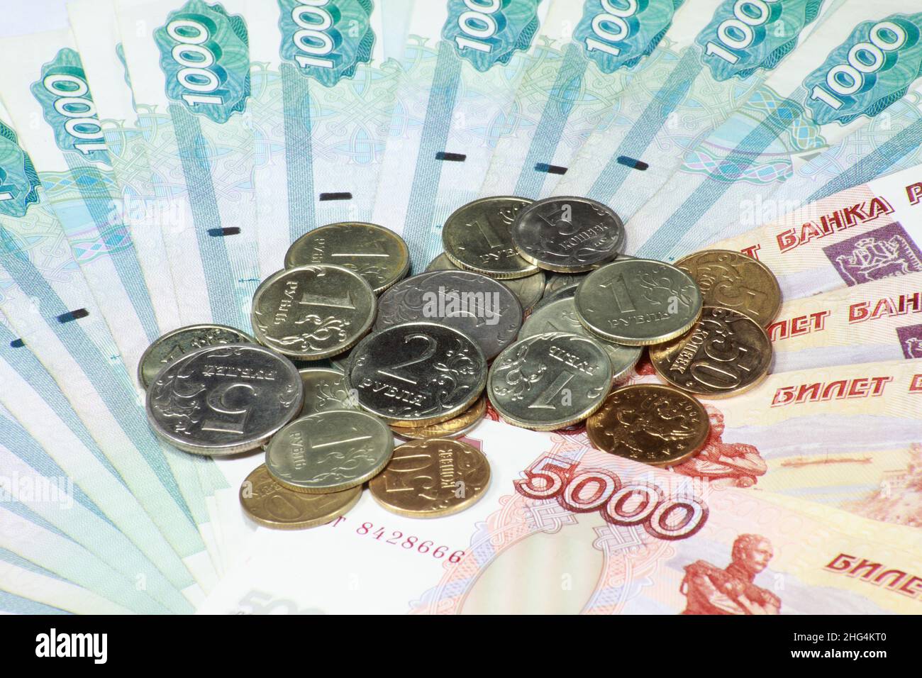 stack of coin and bond scattering Stock Photo - Alamy