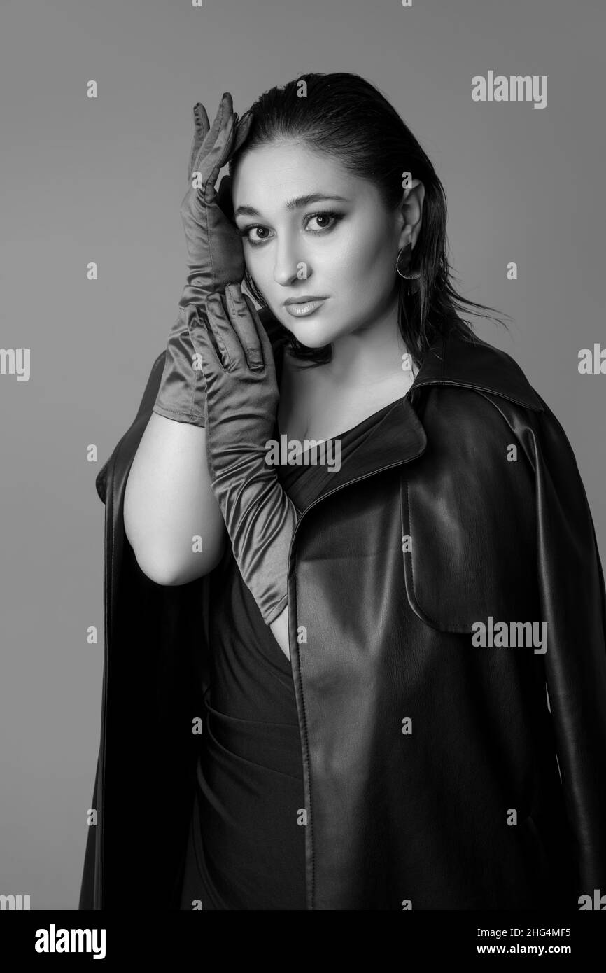 Half-length monochrome portrait of young beautiful woman posing ...
