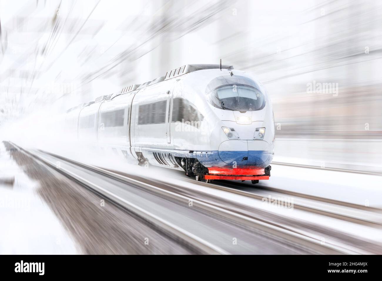High speed train approaches to the station platform at winter day time ...