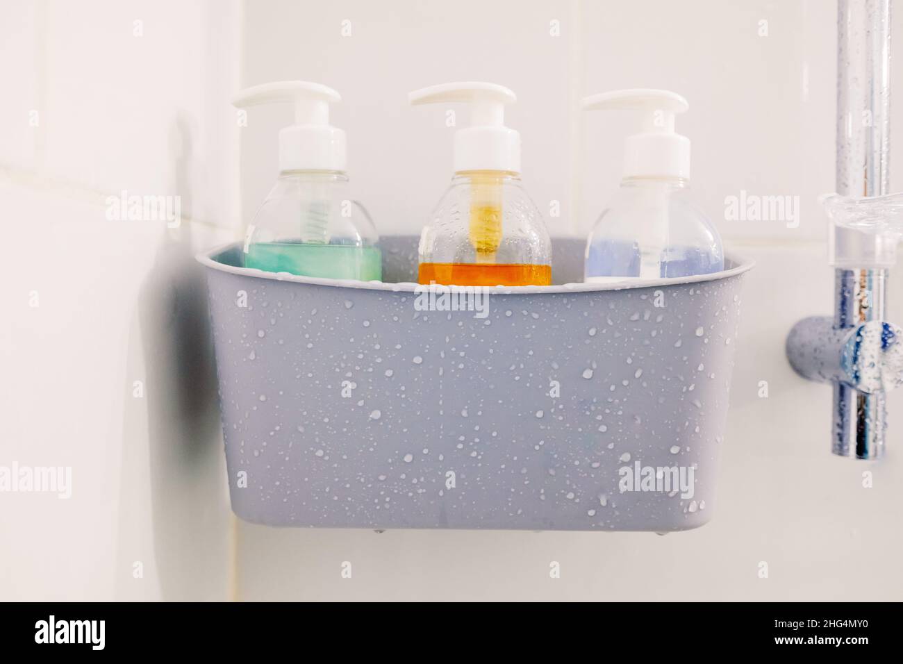 Non-brand soaps and shampoos available in the shower of a vacation ...