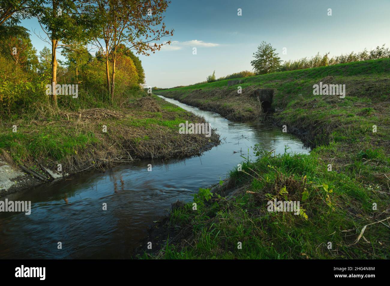 A bend in a small river and a green bank, September view Stock Photo ...
