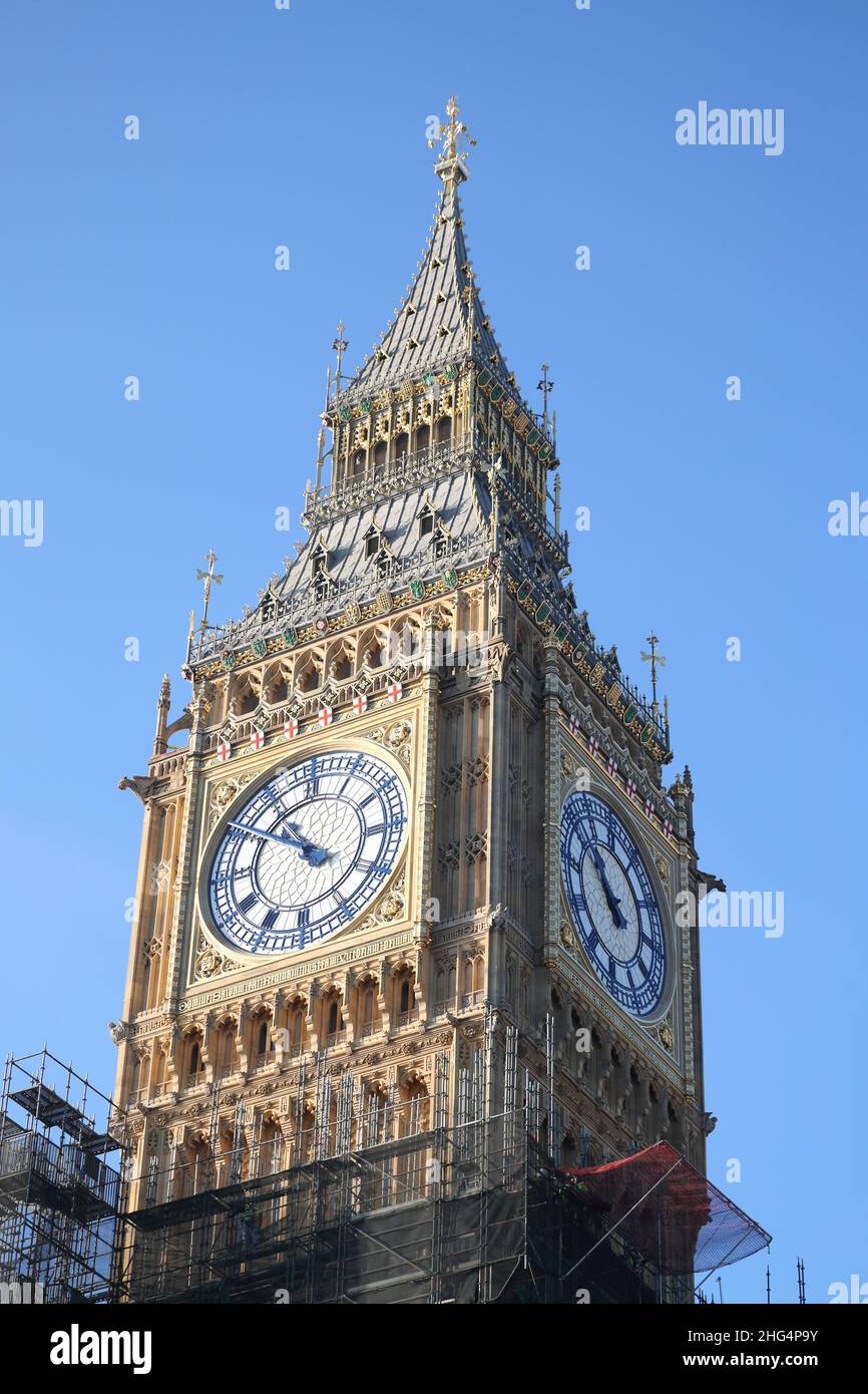 The clock face of the Elizabeth Tower (Big Ben) with blue hands and ...