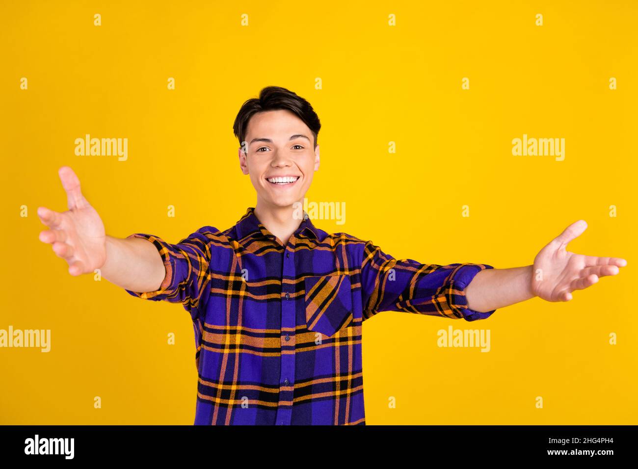 Photo of sweet brunet young guy want hug wear plaid shirt isolated on ...