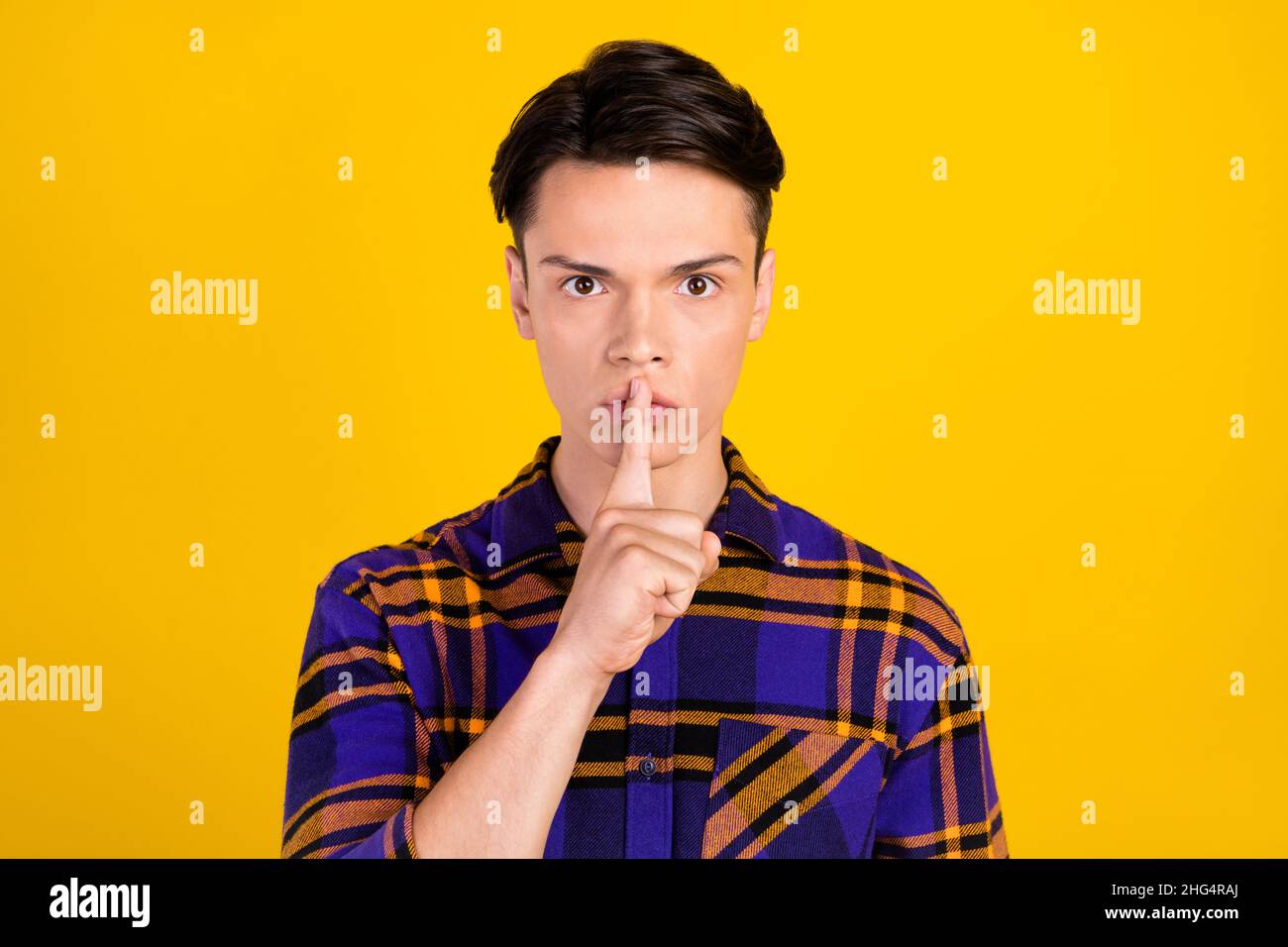 Photo of look brunet millennial guy finger lips wear plaid shirt ...