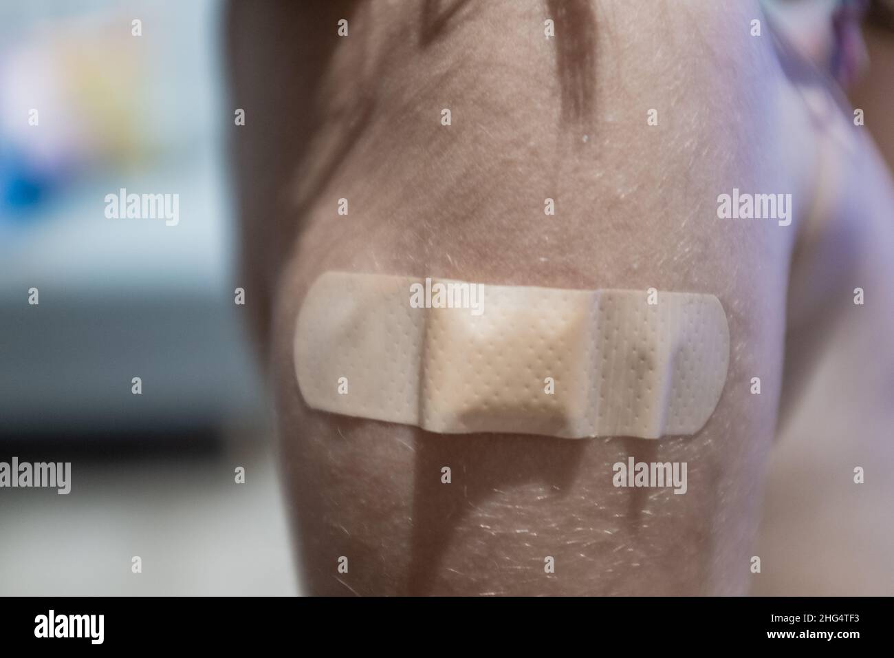 Band aid on a child shoulder after getting vaccinated Stock Photo - Alamy