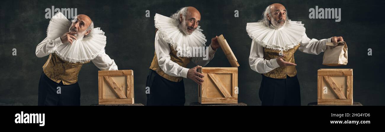 Mystery, magic. Elderly gray-haired man, actor or magician isolated on ...