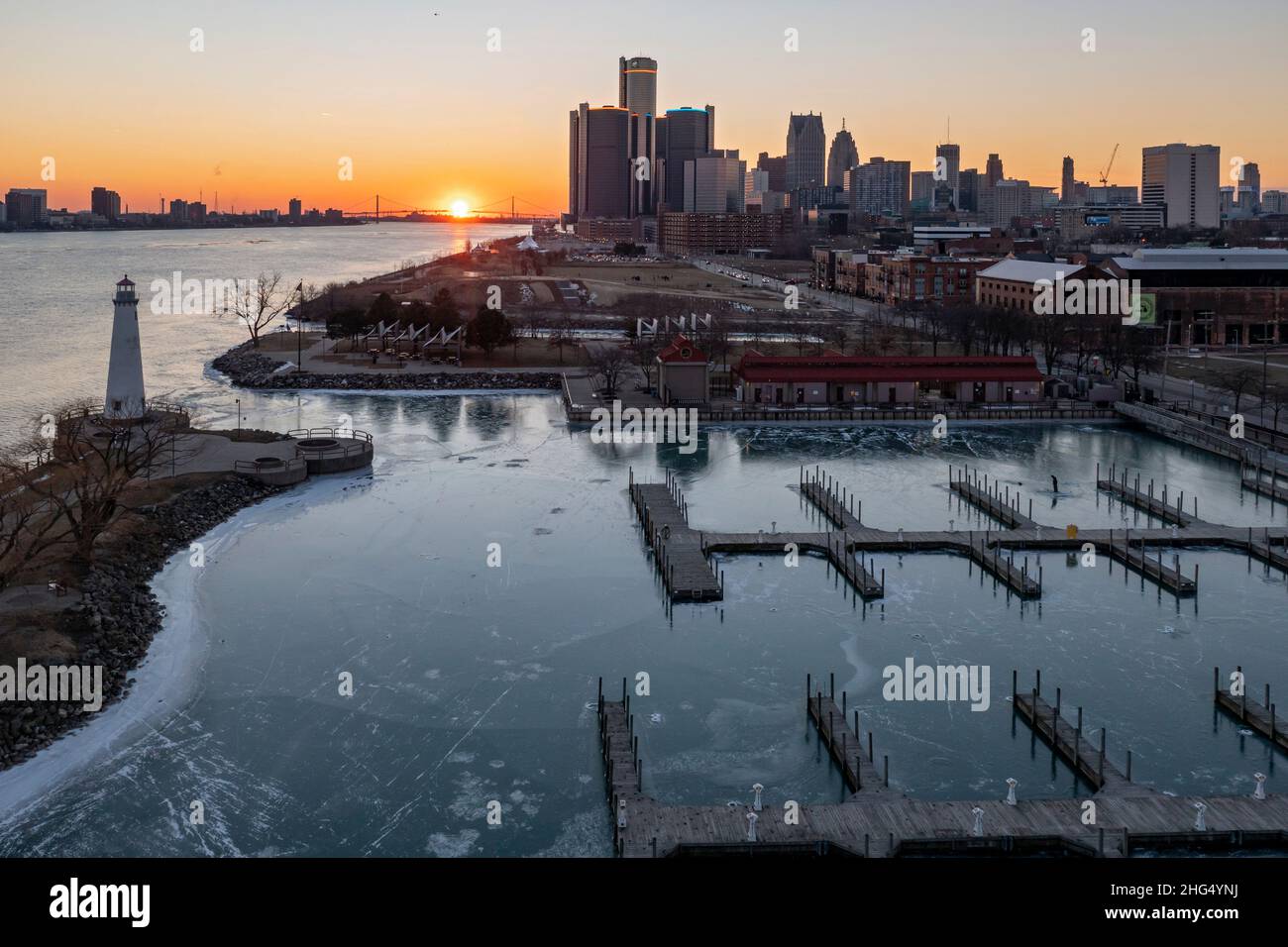 Detroit, Michigan - Downtown Detroit and the Detroit River as the sun ...