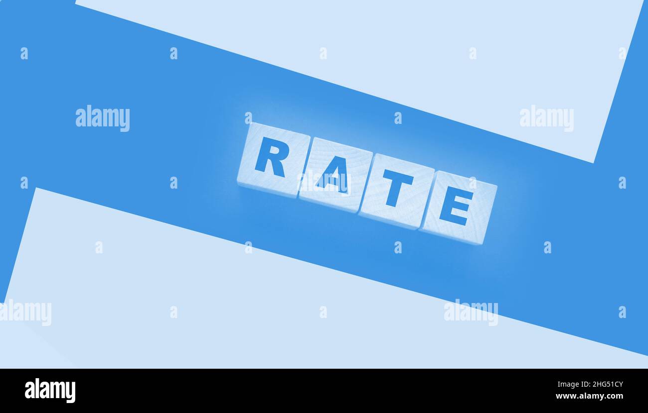 Rate word concept written on wooden cubes blocks lying on a black ...