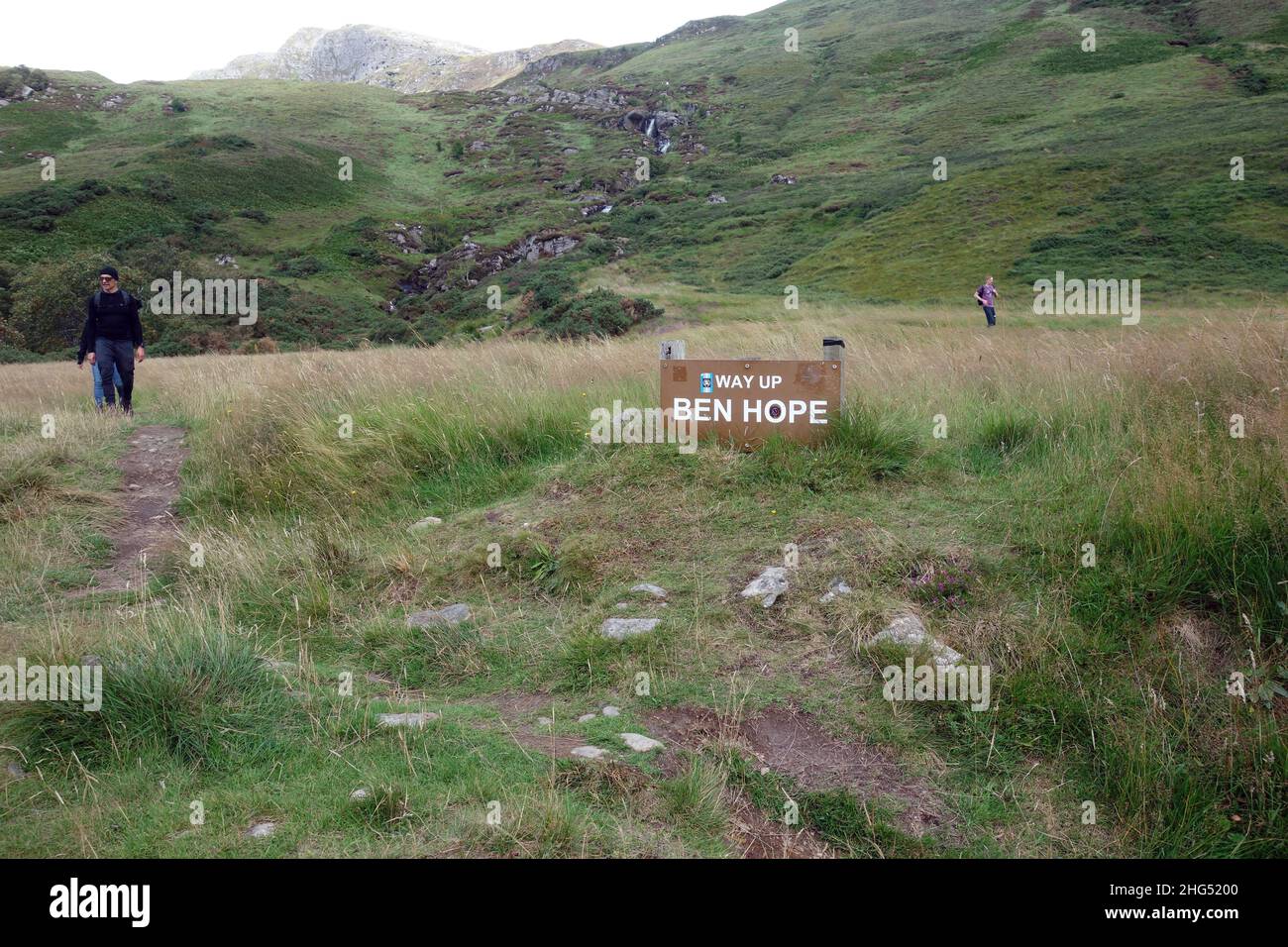 Two People by Wooden Sign for the Way Up the Scottish Mountain Munro ...