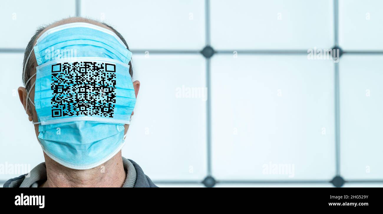 Man with face covered with medical masks and qr code. The concept of ...