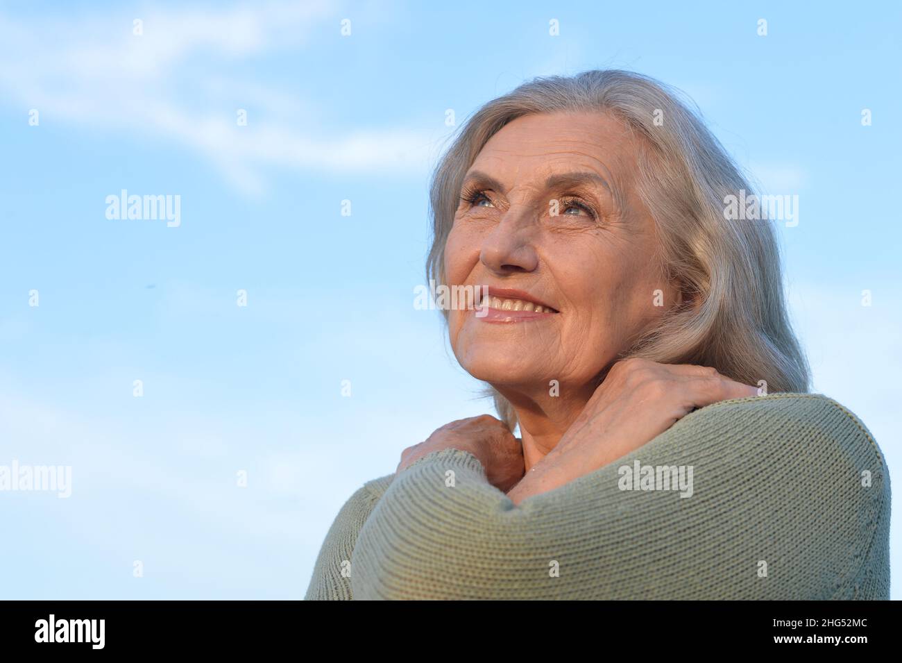 Portrait of happy smiling senior woman outdoors Stock Photo - Alamy