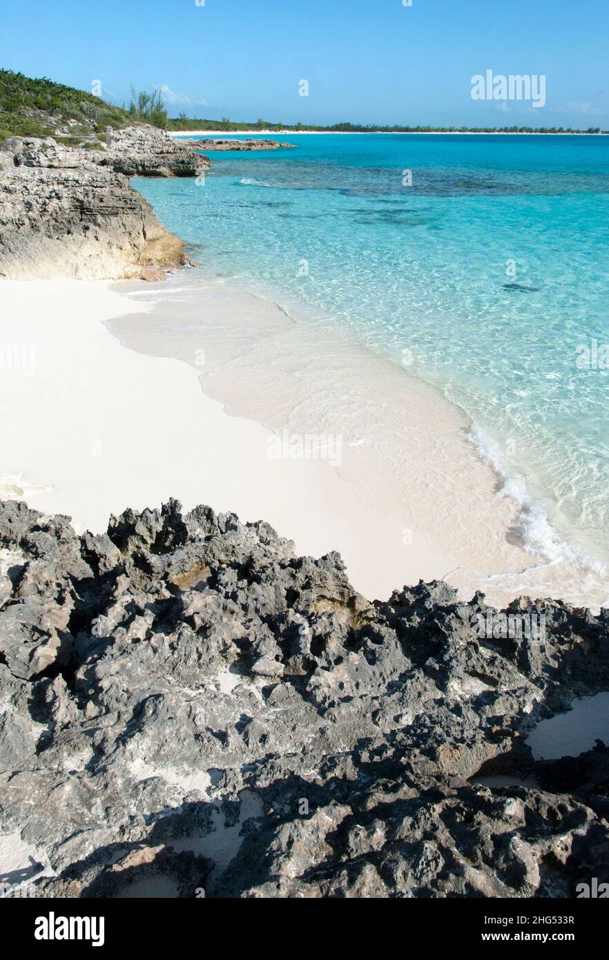 The tiny beach surrounded by rocky coastline on uninhabited Half Moon ...