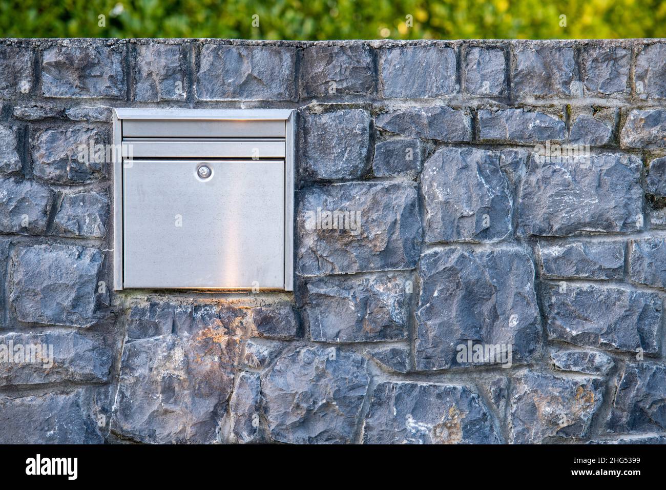 Mailboxes mounted at entry gates, mailboxes embedded in a stone wall ...