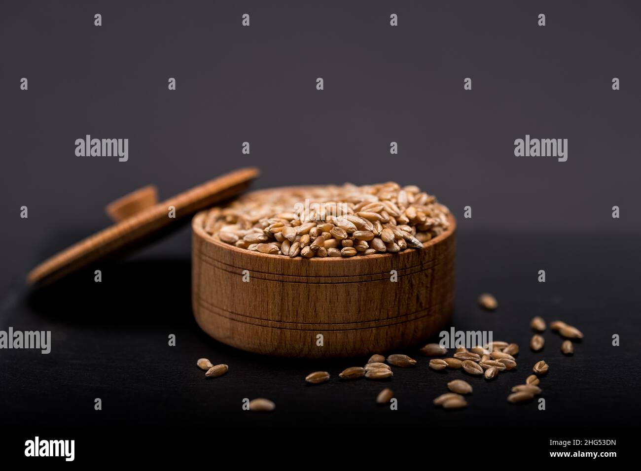 Emmer wheat or hulled wheat in the wooden bowl Stock Photo - Alamy