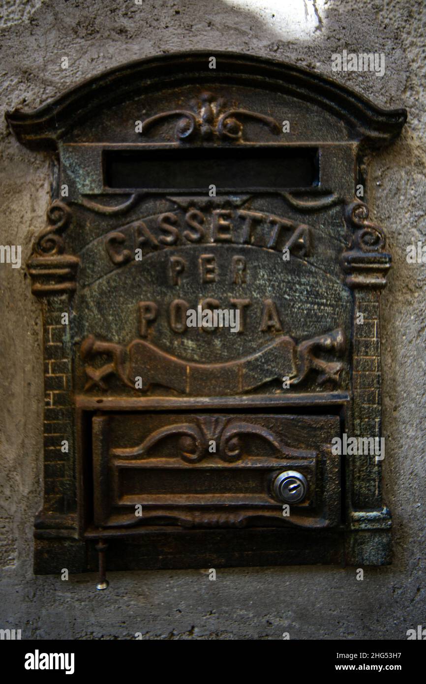 old post box with Italian writing. Italian mailbox. black iron on gray ...