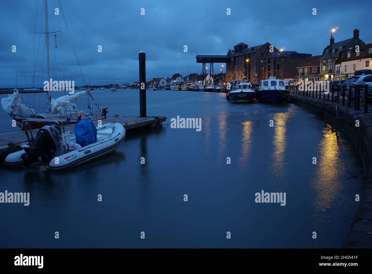 Wells Next The Sea quayside at night, with the lights of the buildings ...