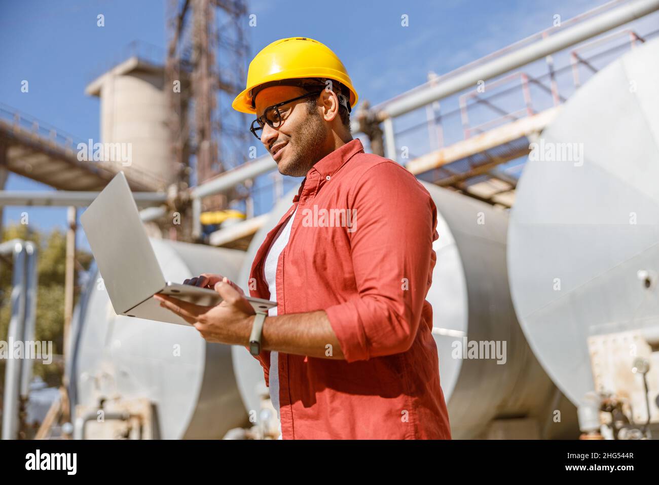Construction worker is leading production process outdoors Stock Photo ...